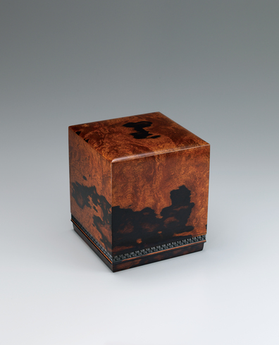 Square box of black-streaked persimmon wood coated with red urushi ...